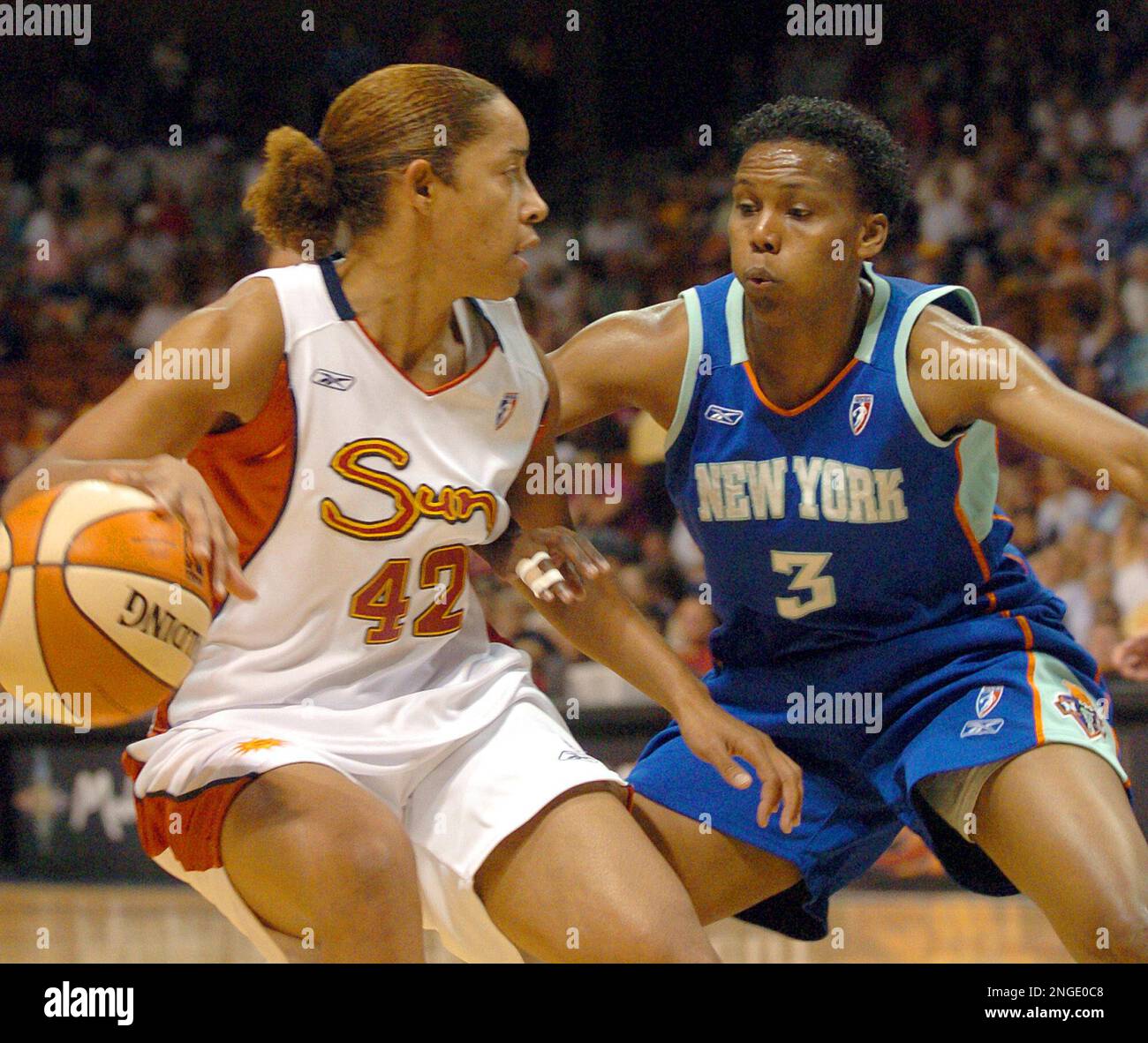The Connecticut Sun's Nykesha Sales, left, encounters the New York ...