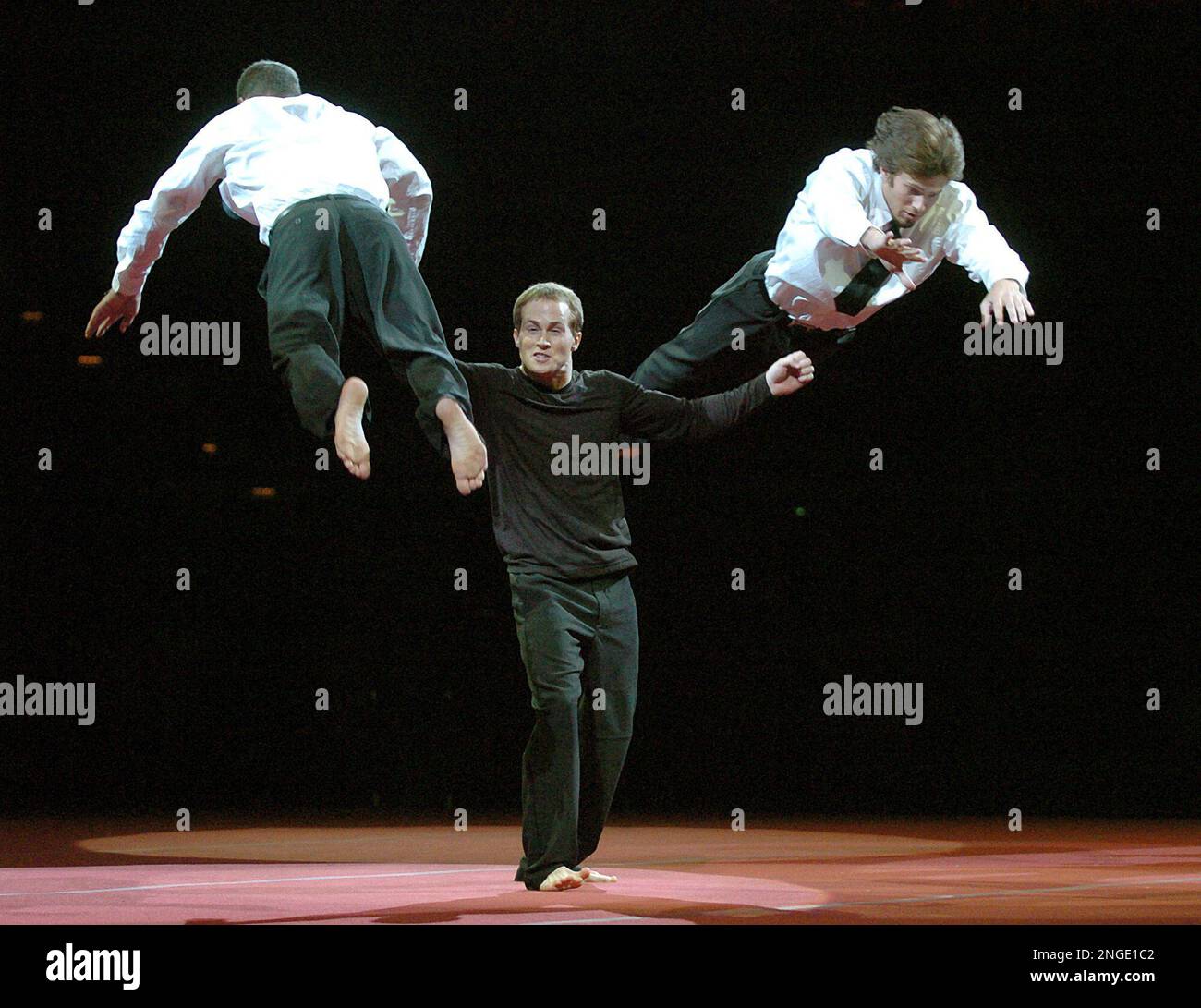 Paul Hamm, the Olympics' all-around Olympic gold medalist, center, performs in a gymnastics show ...