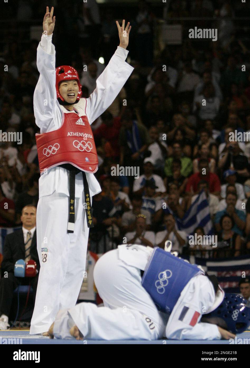 Chen Zhong, from China, celebrates after defeating Myriam Baverel, on ...