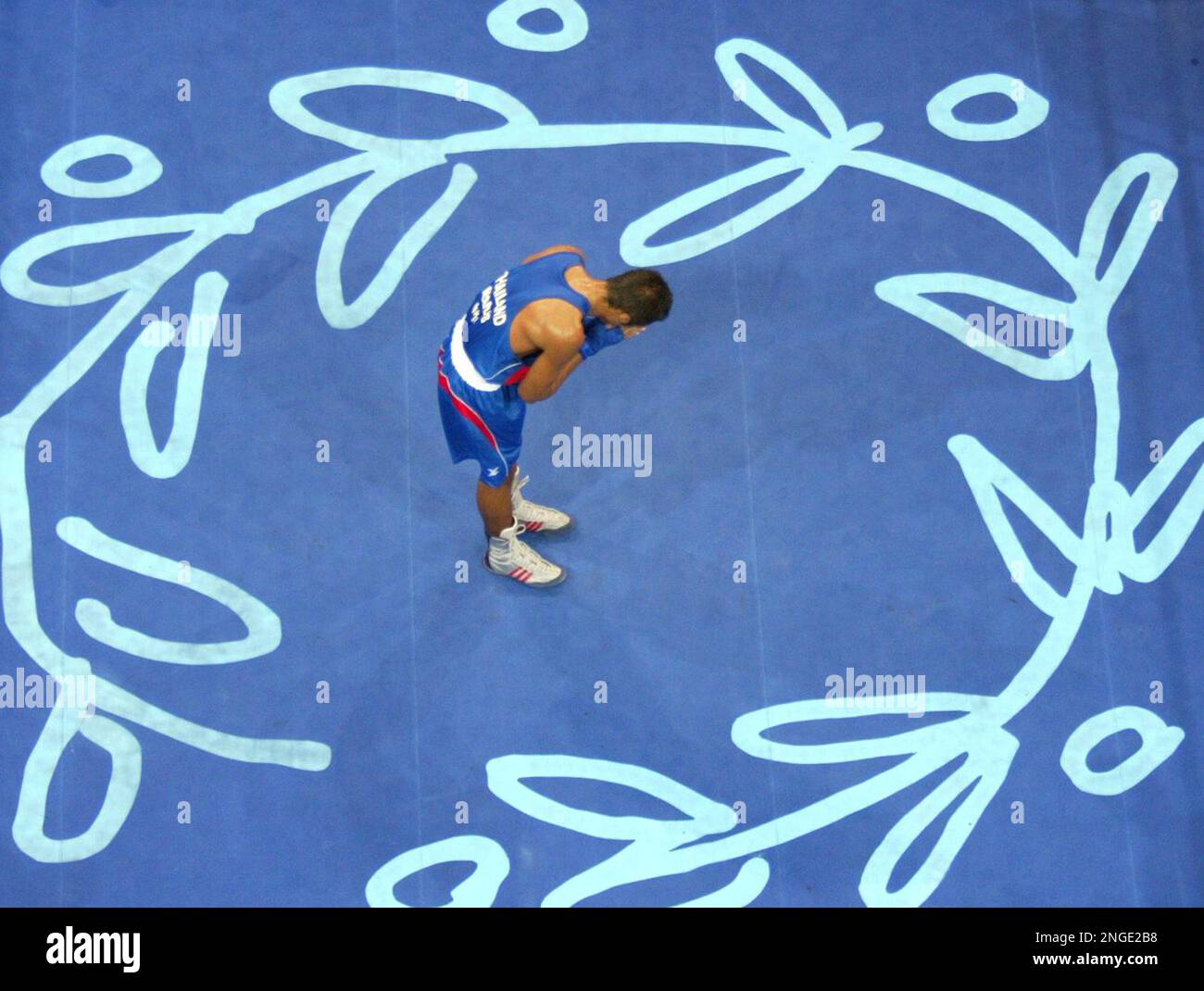 Thailand's Boonjumnong Manus prays on the ring after defeating Cuba's ...