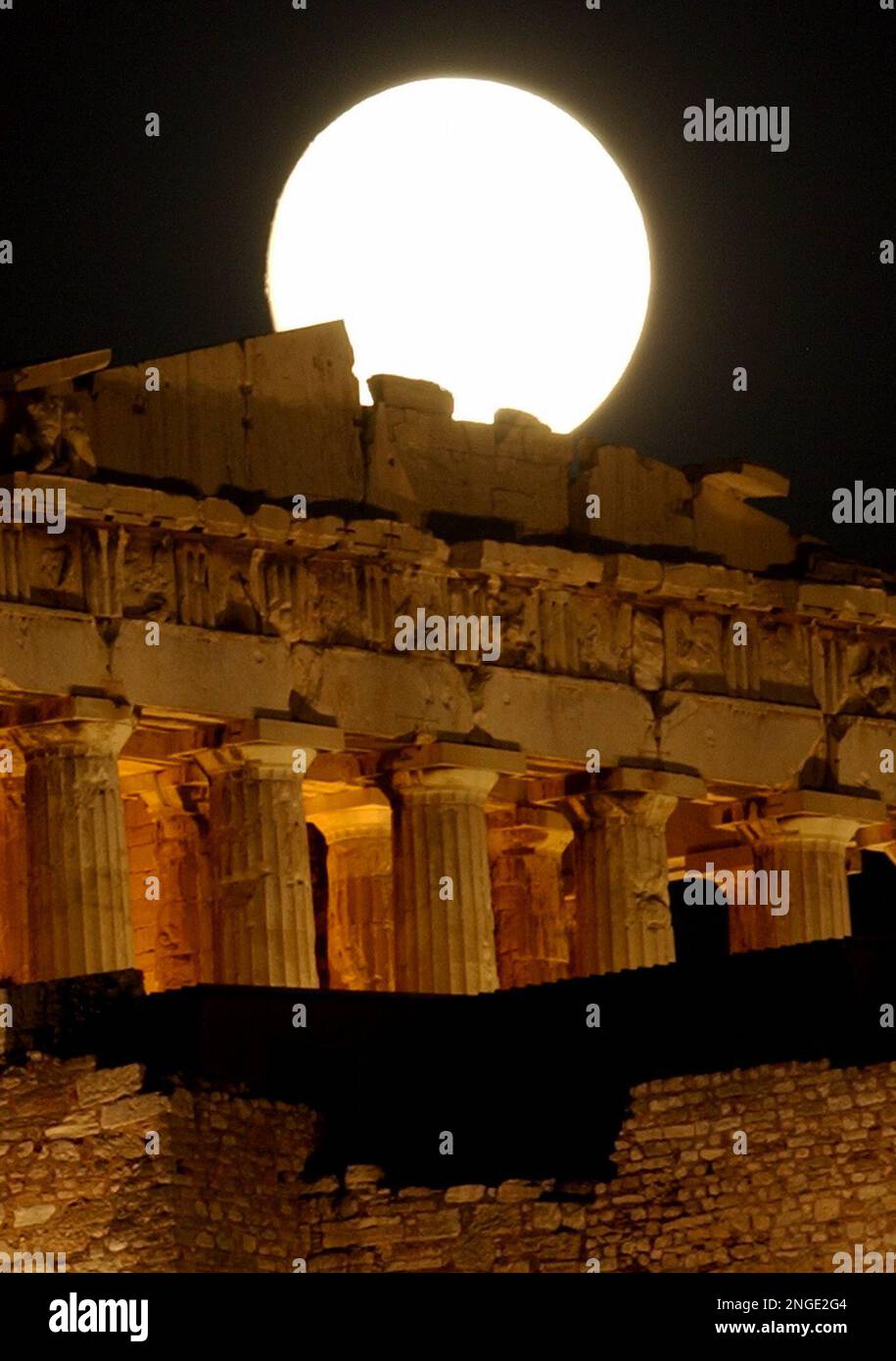 The ancient Parthenon is illuminated by the moon in Athens on Saturday ...