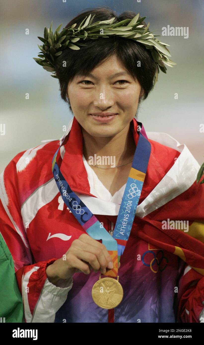 ** CORRECTED VERSION ** China's Huina Xing poses with her gold medal ...