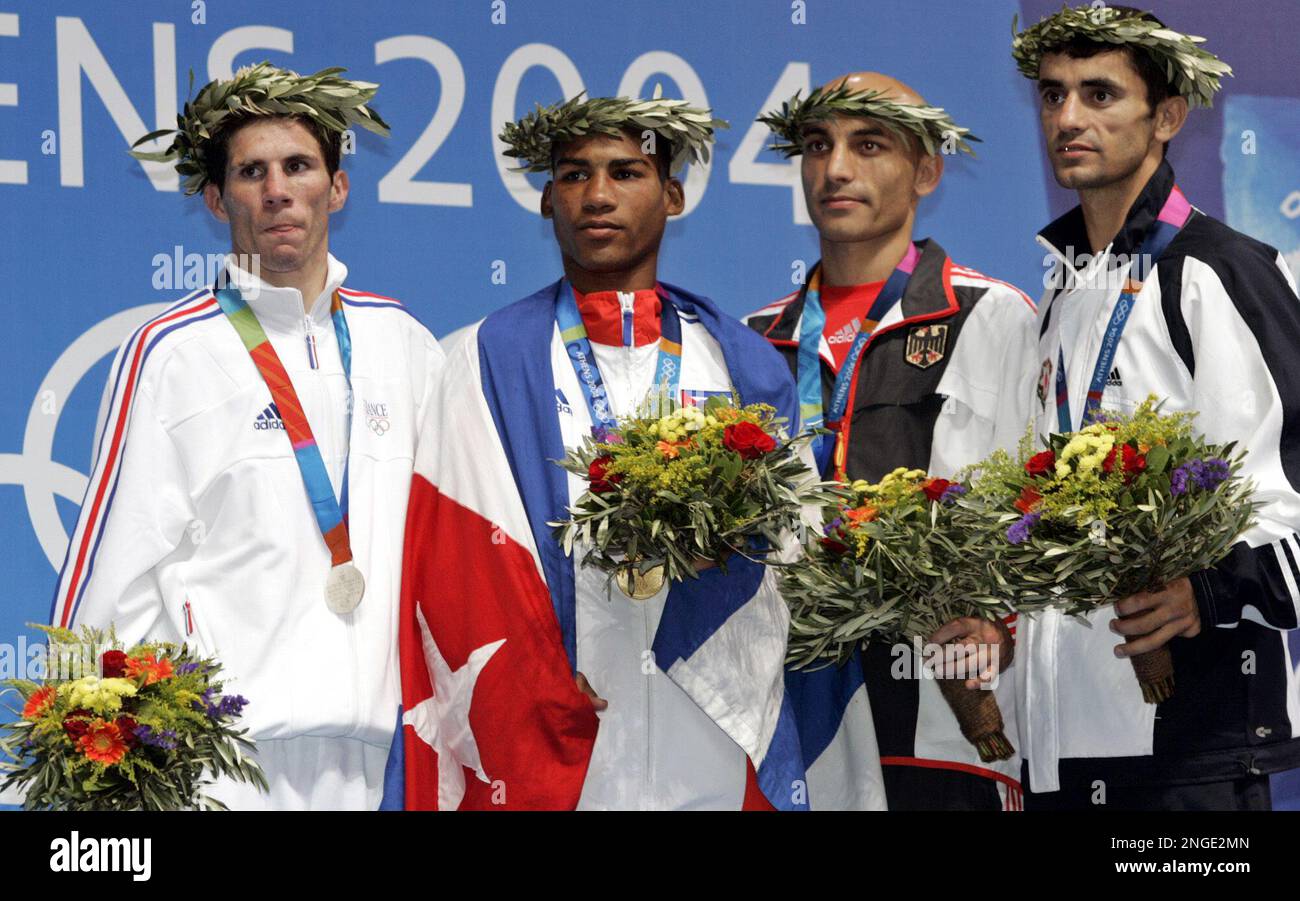 Gold medal winner Cuba's Yuriorkis Gamboa Toledano, 2nd from left, is ...
