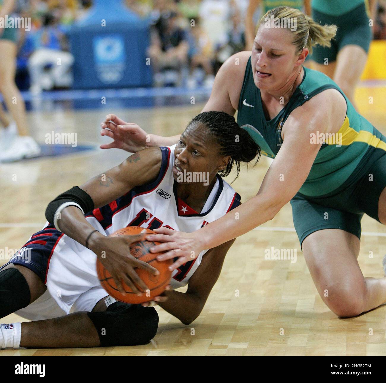 Australia's Suzy Batkovic, right, dives for a ball held by the USA's ...
