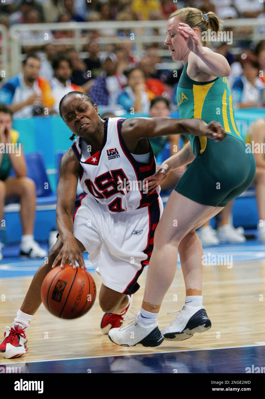 The USA's Shannon Johnson (4) is guarded by Australia's Kristi Harrower ...