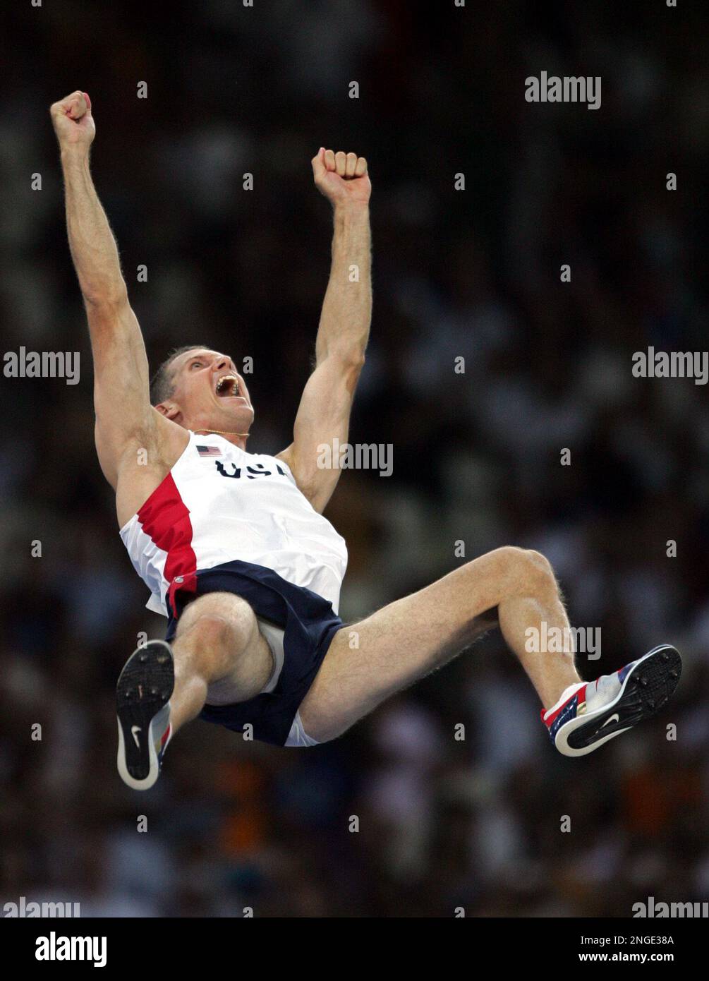 Timothy Mack of the United States reacts after clearing the bar in the ...