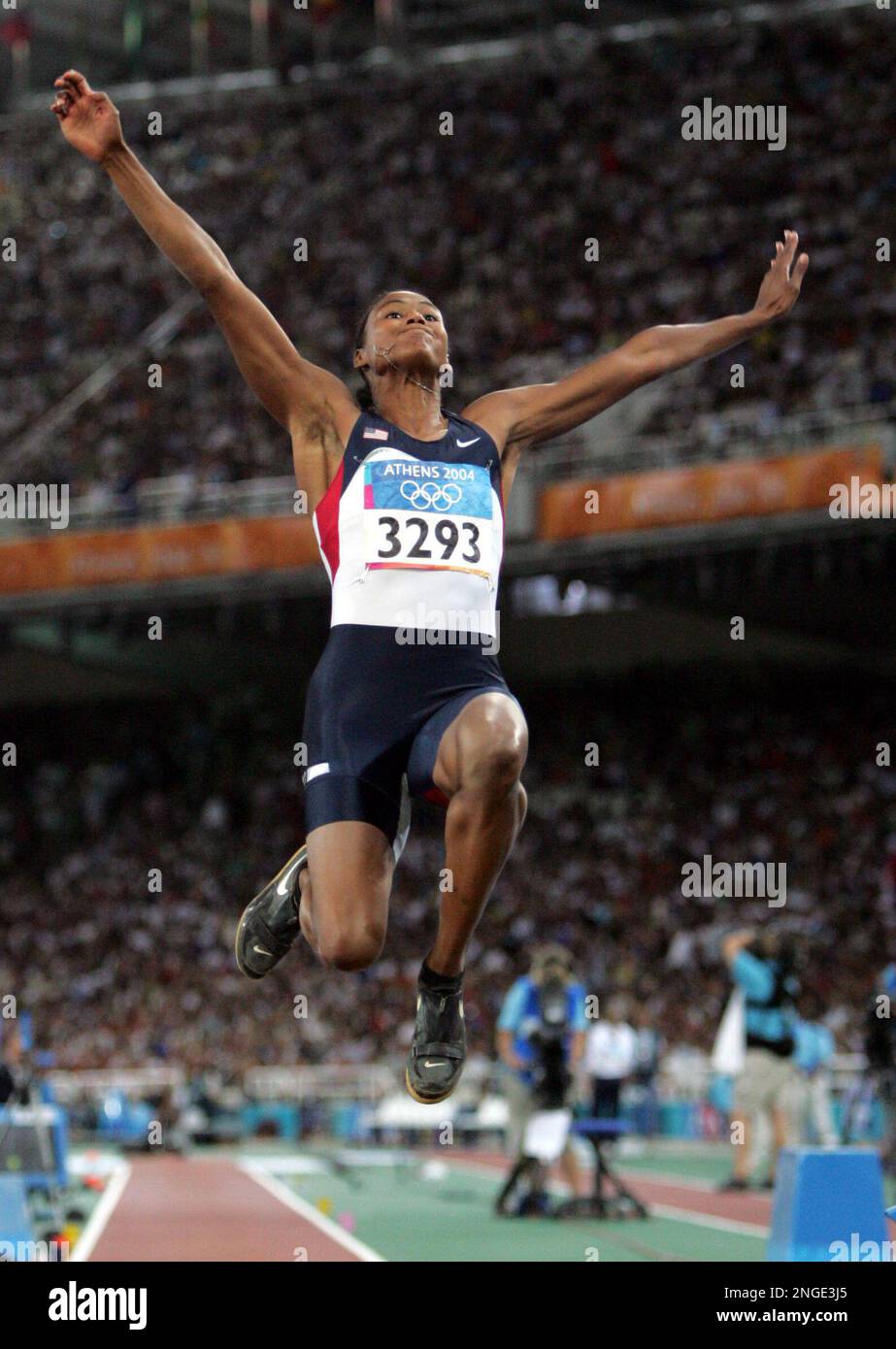 Marion Jones of the United States competes in the long jump final at ...