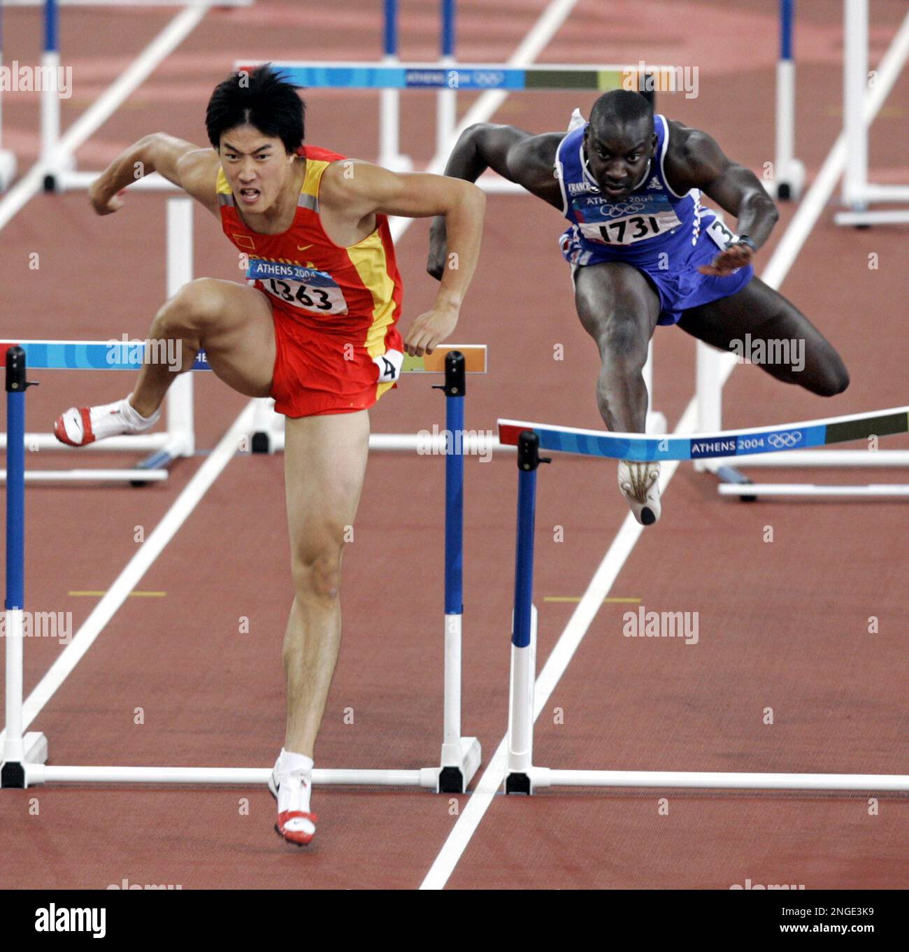 China's Liu Xiang clears the final hurdle en route to winning the gold ...