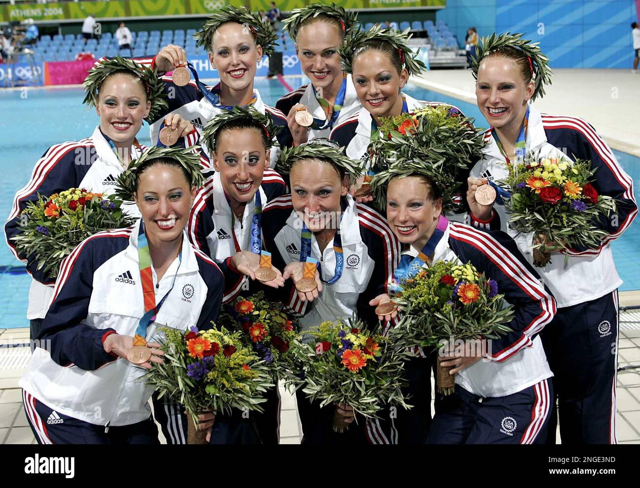 Members of the USA's team show their bronze medals following the medal ...