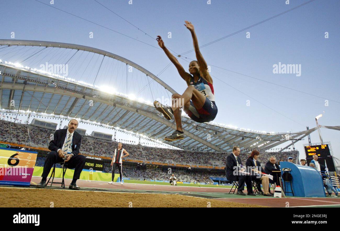 Marion Jones of the United States competes in the long jump final at ...