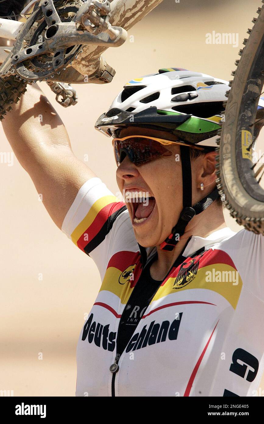 Germany's Sabine Spitz reacts as she crosses the finish line to win the ...