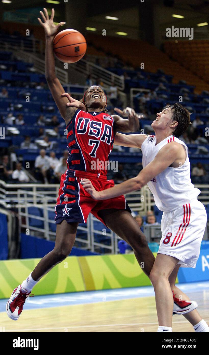 Russia's Elena Baranova, right, commits an intentional foul on the USA ...