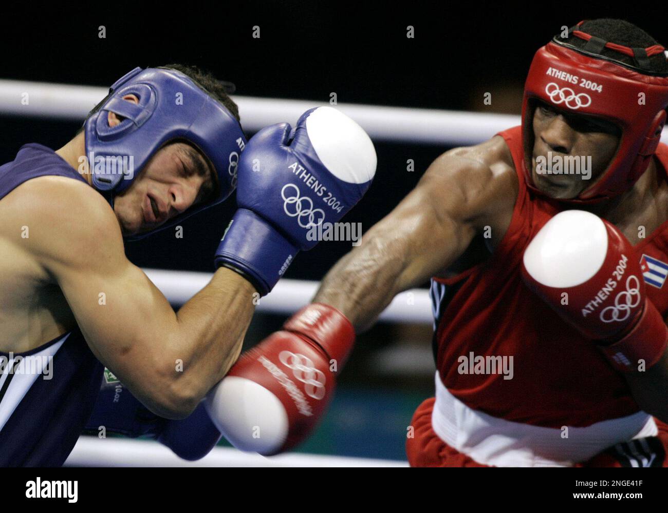 Cuba's Odlanier Solis Fonte, right, delivers a blow to Syria's Naser Al Shami during the ...