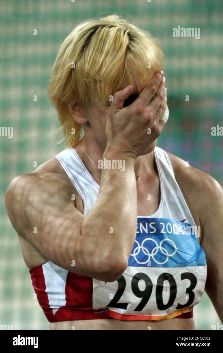 Russia's Olga Kuzenkova reacts after winning the gold medal in the ...