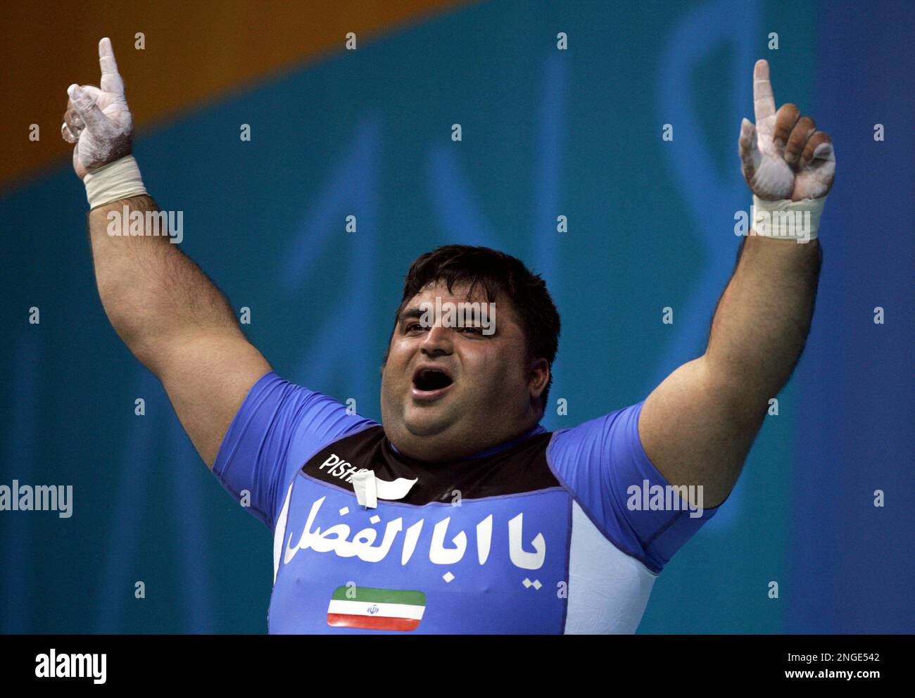Gold medalist Hossein Reza Zadeh of Iran lifts 551 pounds (250 kg) in ...