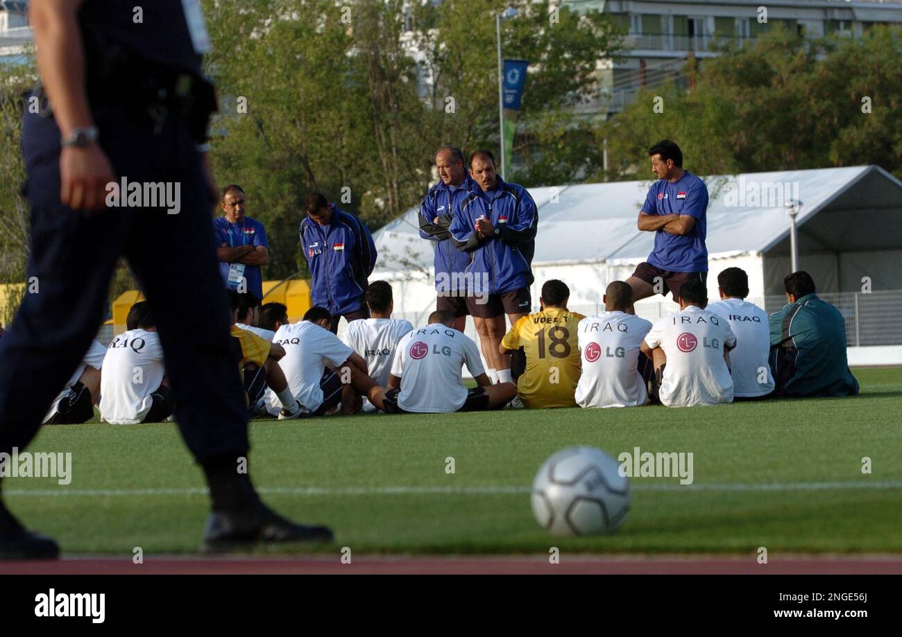Members of the Iraqi Olympic soccer team are adressed by their coach ...