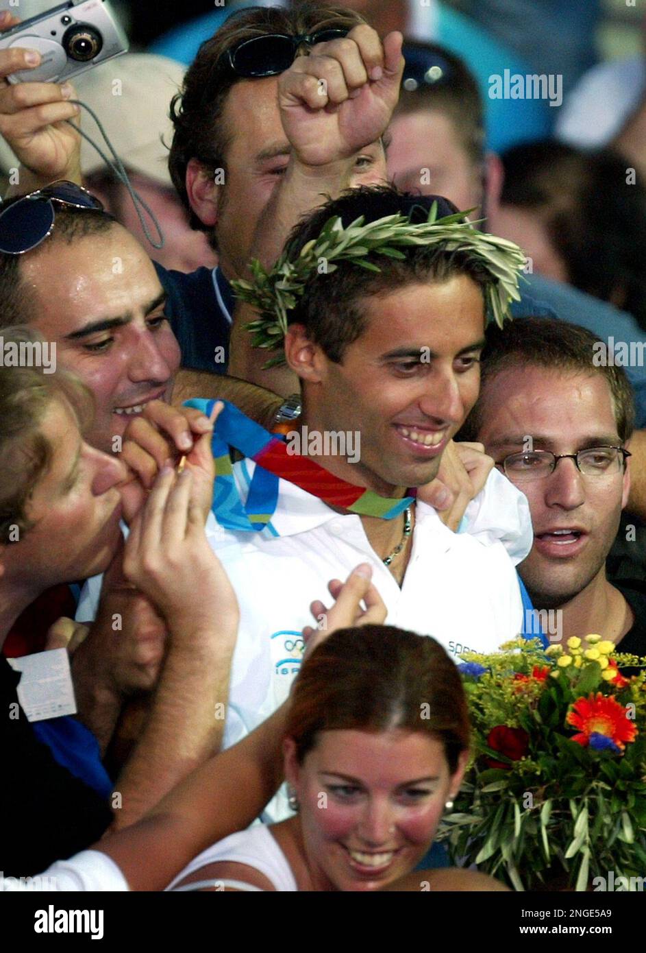 Israel's gold medalist Gal Fridman is surrounded by spectators during ...