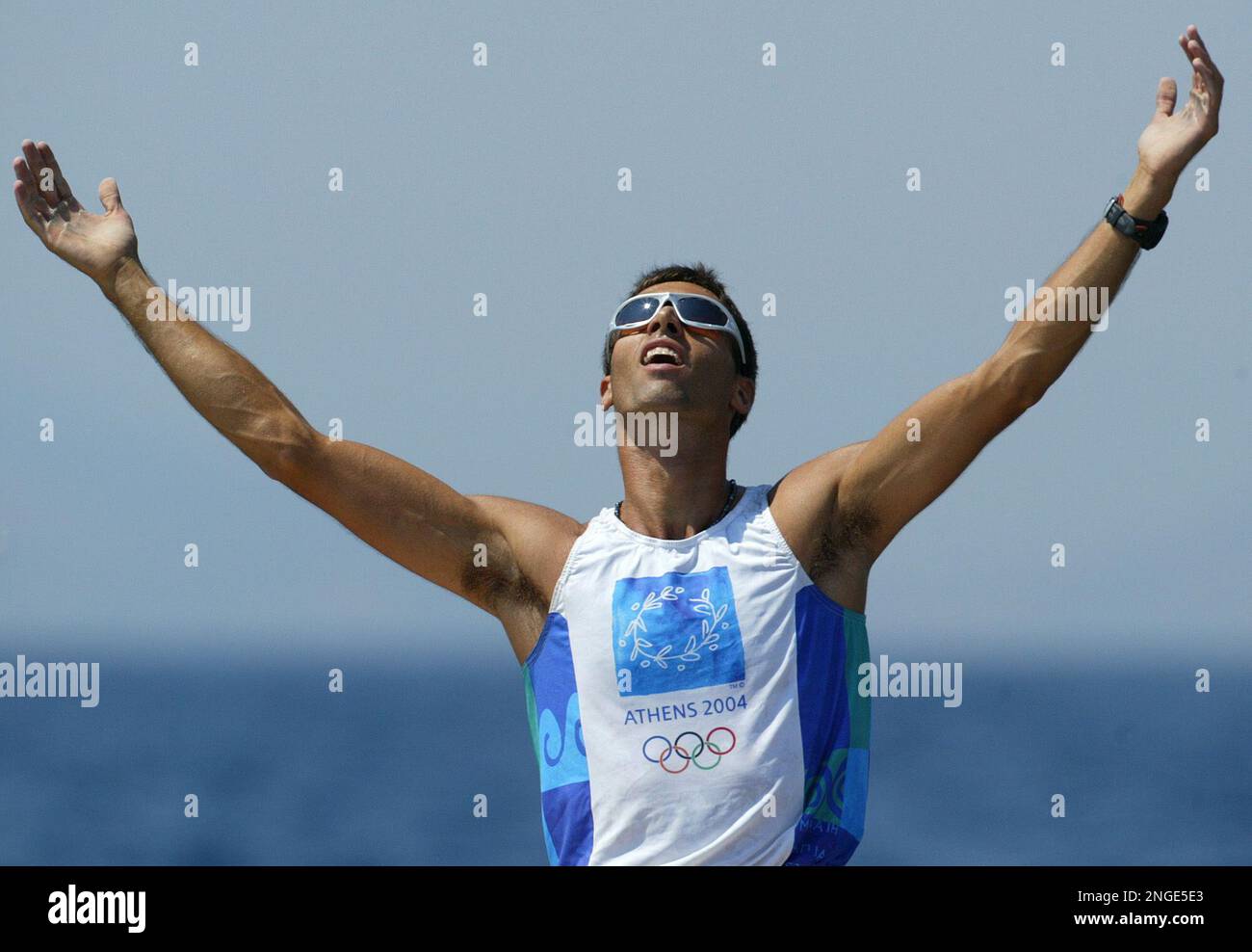 Israel's Gal Fridman celebrates as he crosses the finish line of the ...