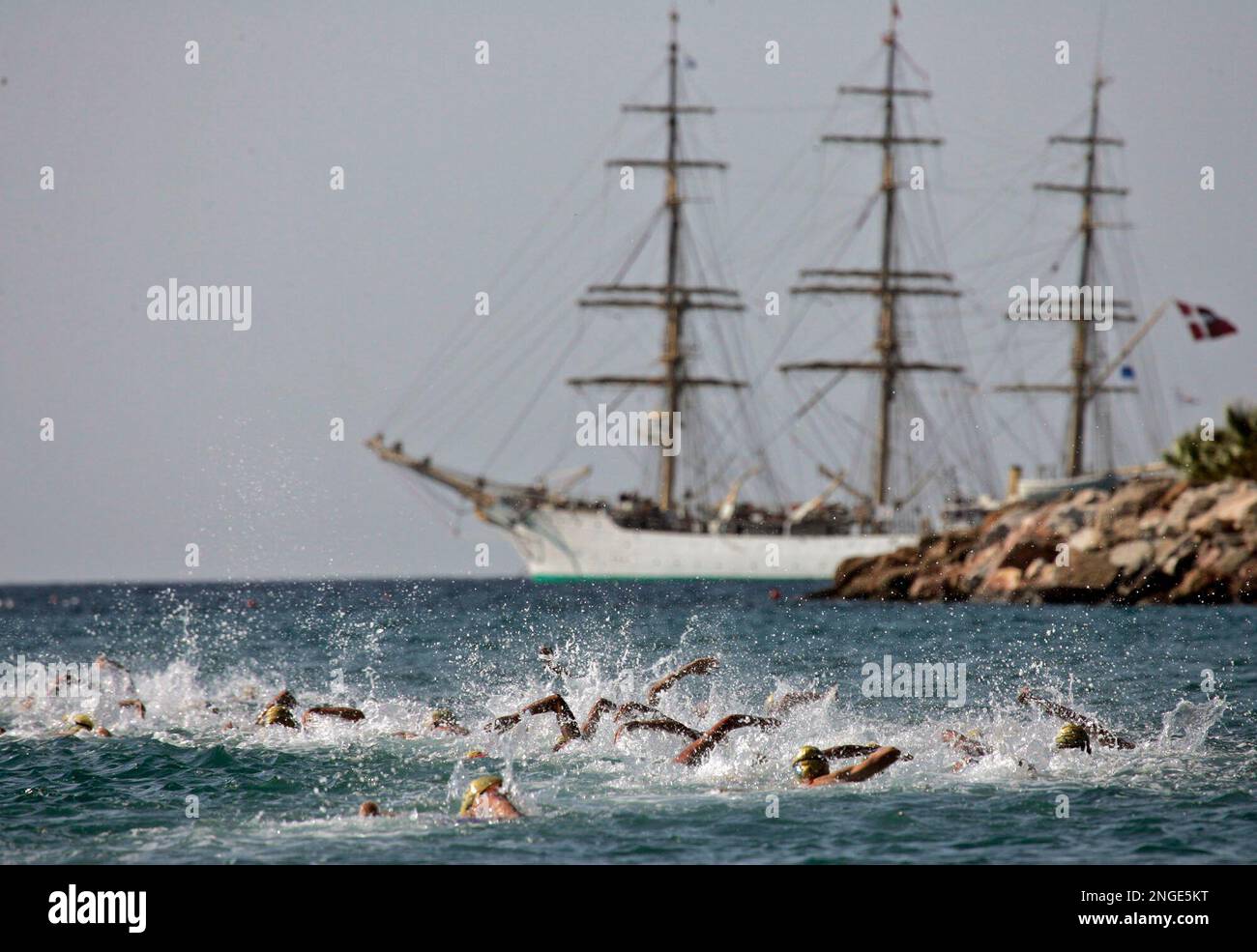 Competitors swim during the women's triathlon Wednesday, Aug. 25, 2004 ...