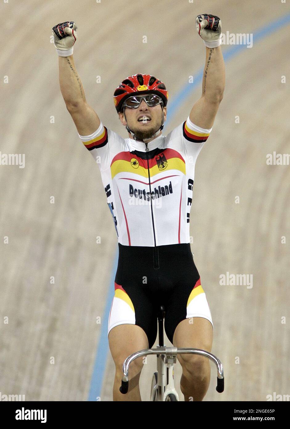 Germany's Rene Wolff celebrates after winning the bronze medal in the ...