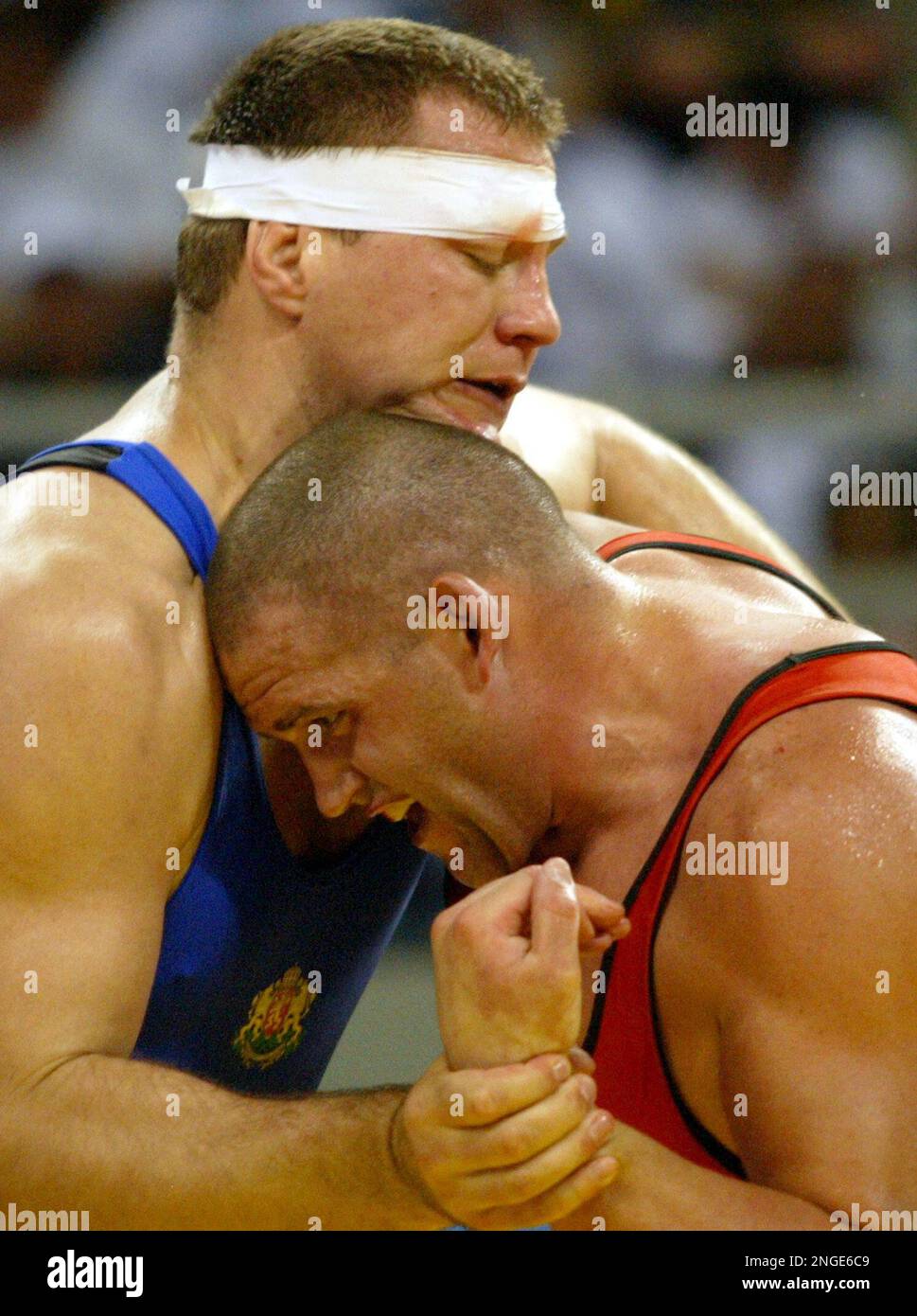 Rulon Gardner, of the United States, right, wrestles Serguey Moreiko ...