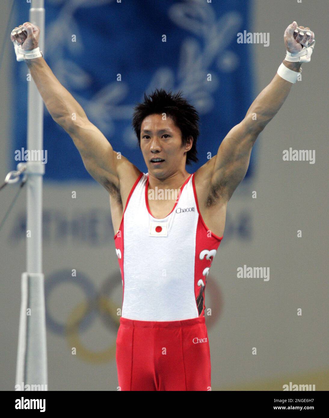 Isao Yoneda of Japan sticks his landing in the high bar during the men ...