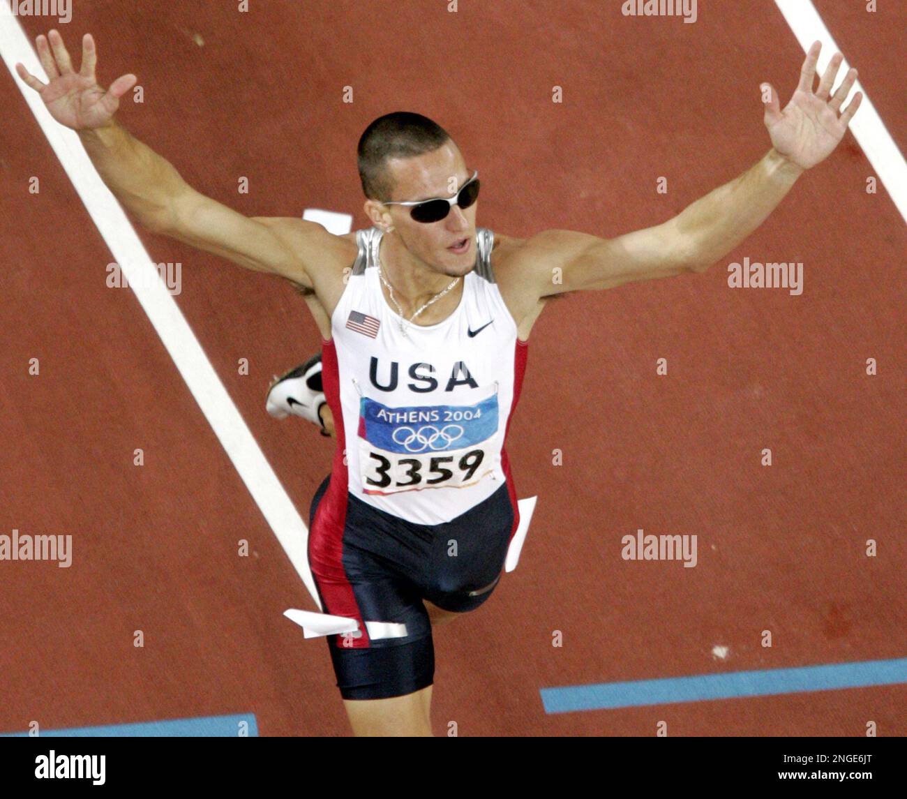 Jeremy Wariner, of the United States, reacts after winning the gold ...