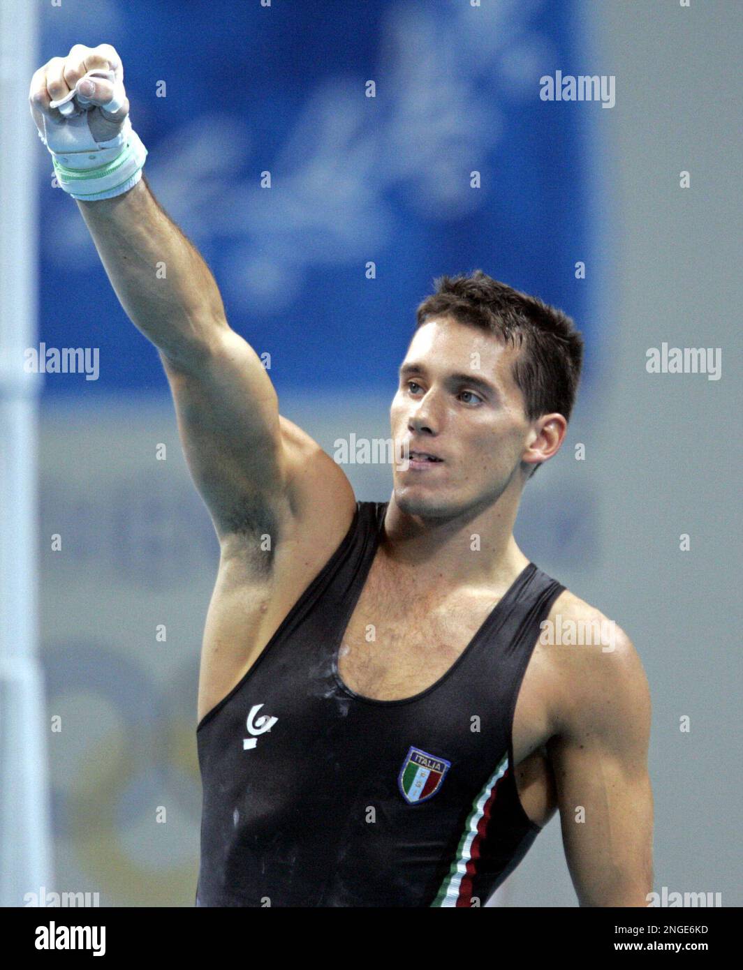 Igor Cassini of Italy reacts after sticking his landing in the high bar ...