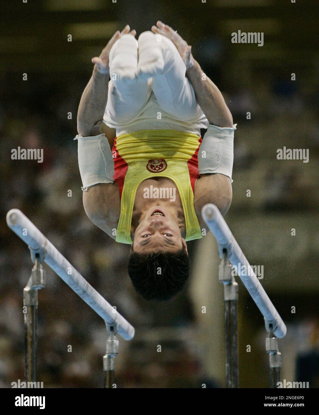 China's Li Xiaopeng performs his bronze medal routine on the parallel ...