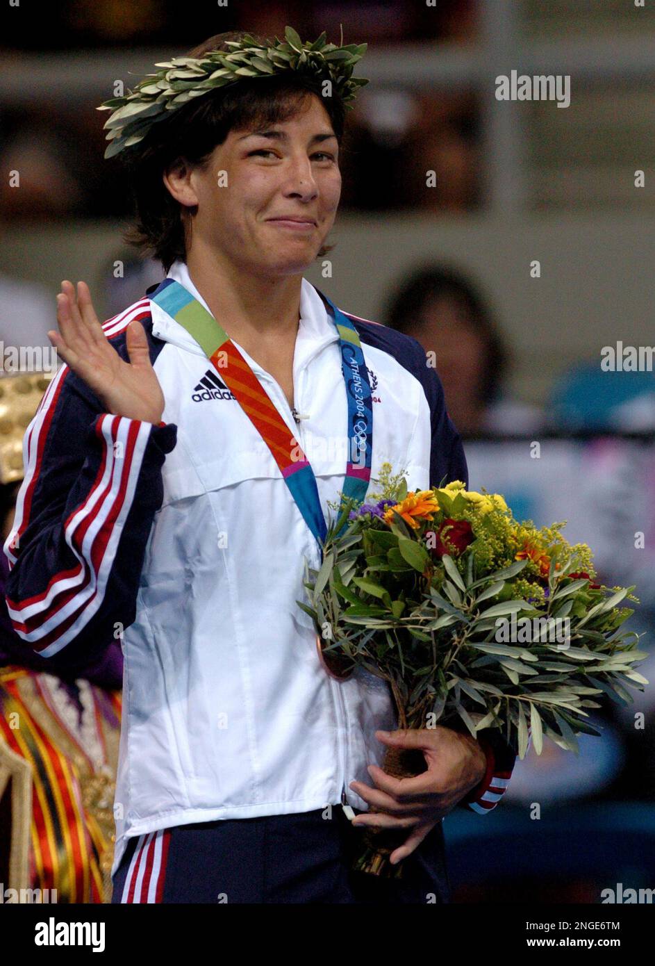 Patricia Miranda from the USA waves after receiving the bronze medal ...