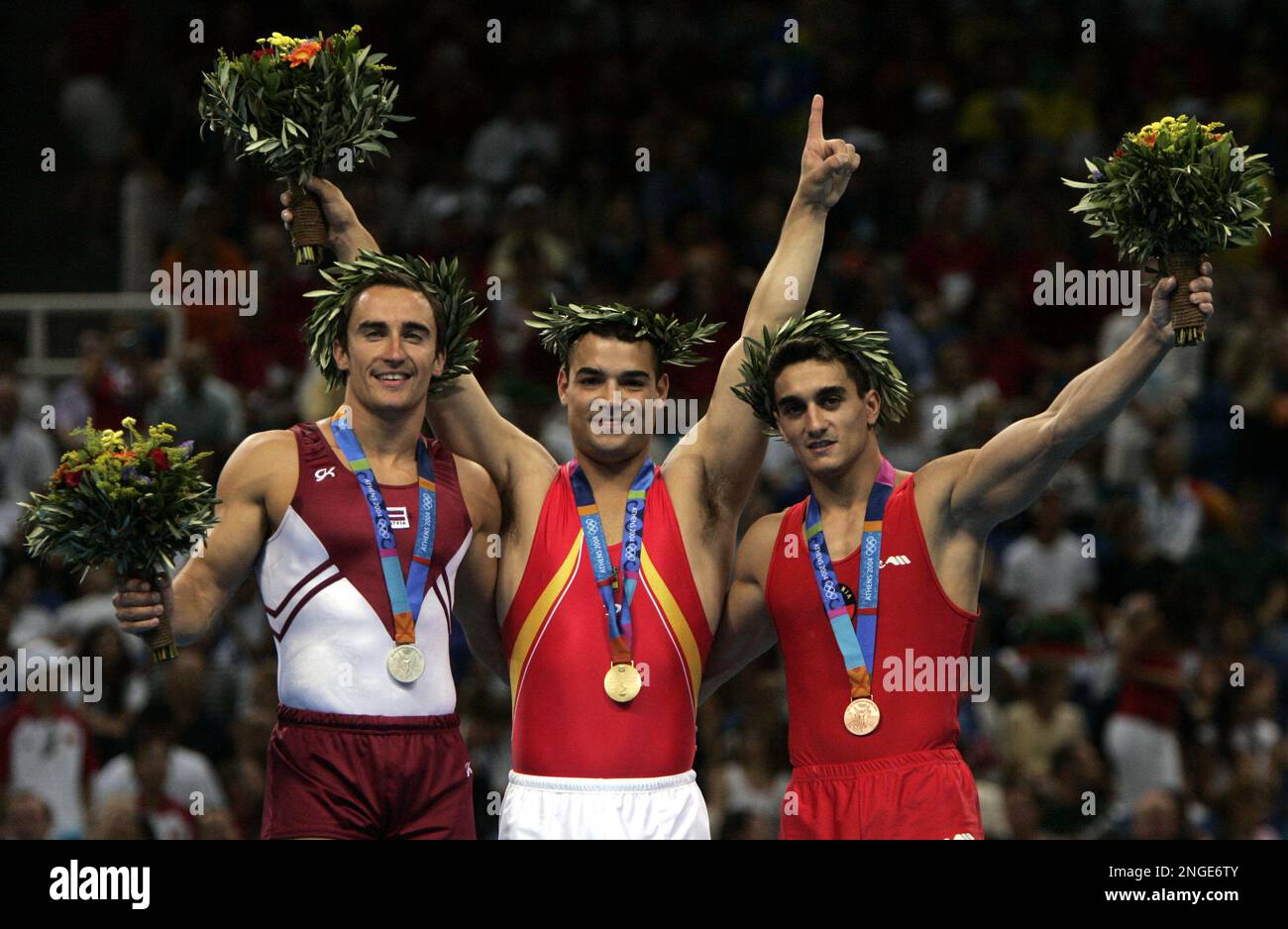 Silver-medalist Evgeni Sapronenko of Latvia, left, gold-medalist ...