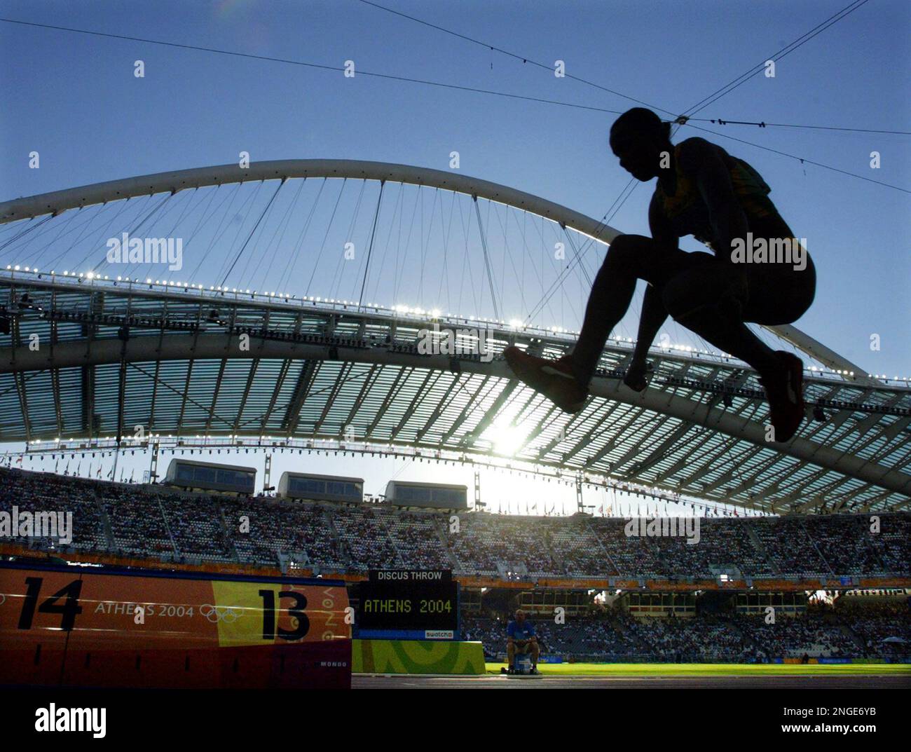 Trecia Smith, of Jamaica, is sillouted as she competes in the triple ...