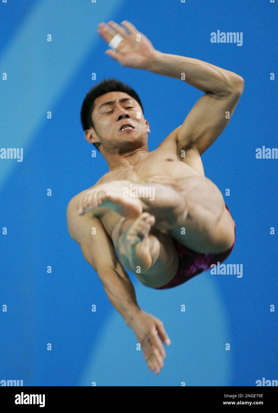 China's Wang Feng competes in the preliminaries of the Men's 3 meter ...