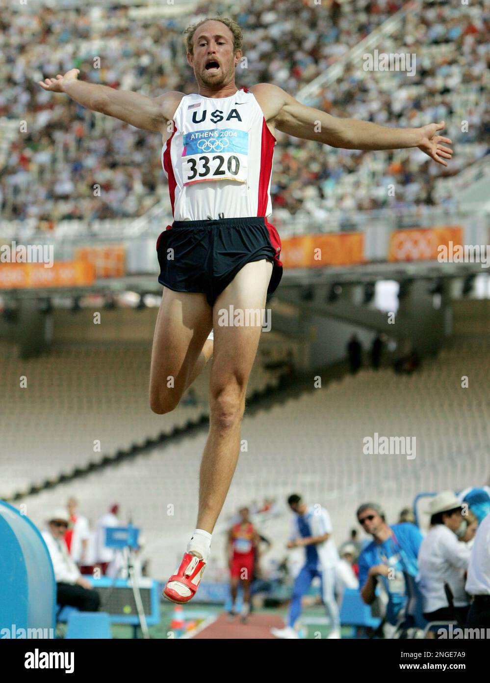 Tom Pappas of the US competes in the decathlon long jump at the 2004 ...