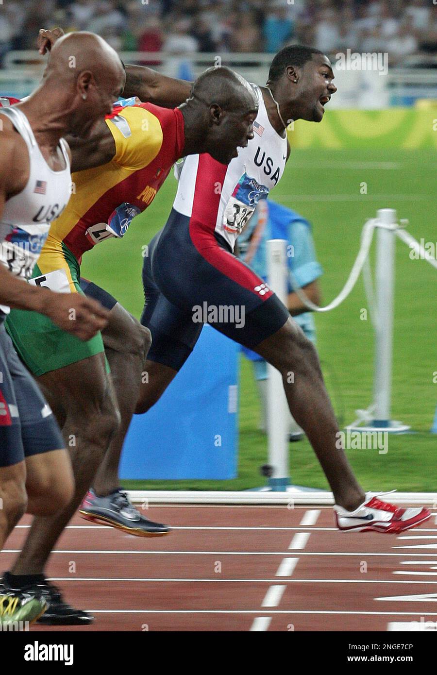 Justin Gatlin, right, of the U.S., wins the 100m at the 2004 Olympic ...