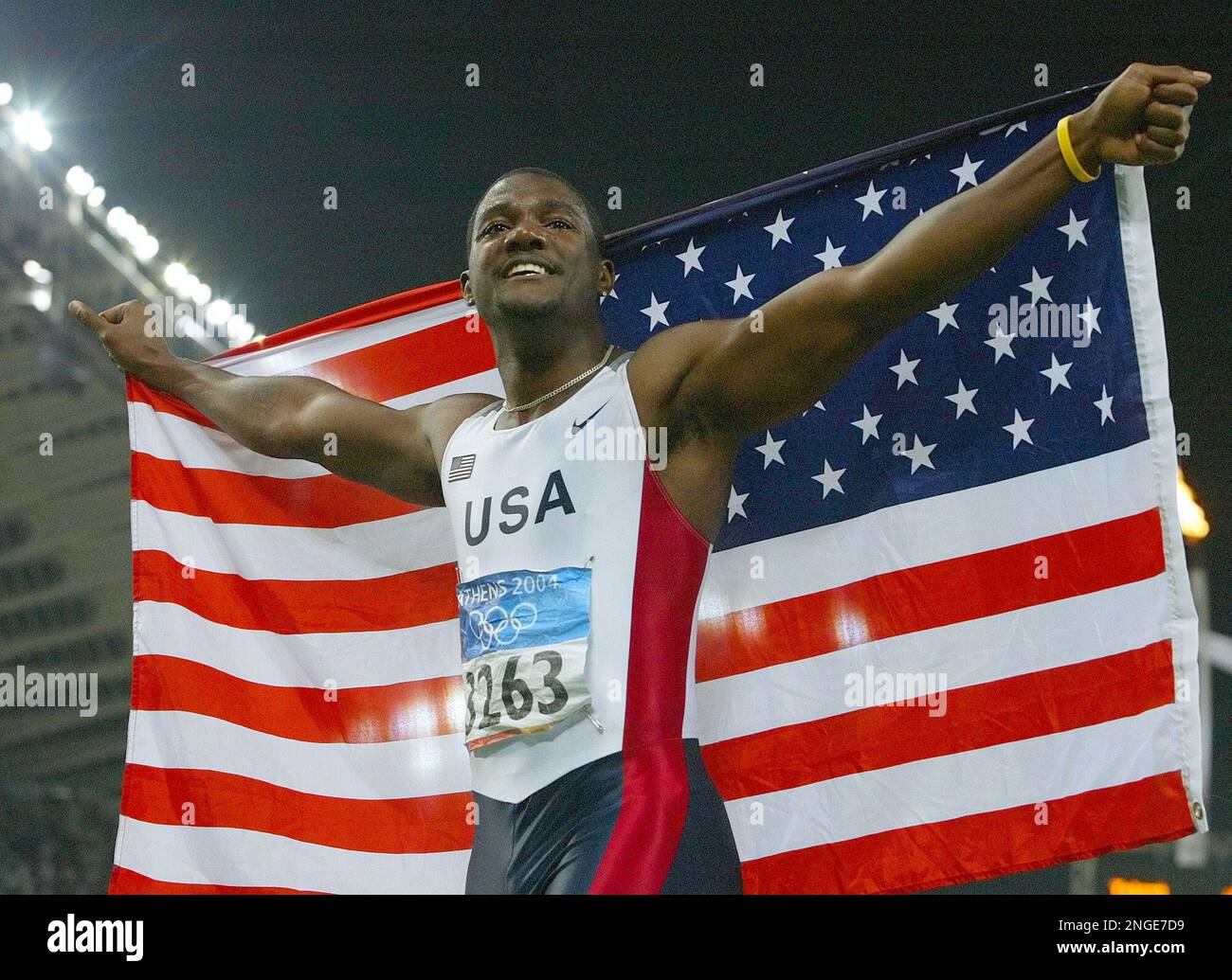 Justin Gatlin, of the United States, celebrates after winning the gold ...
