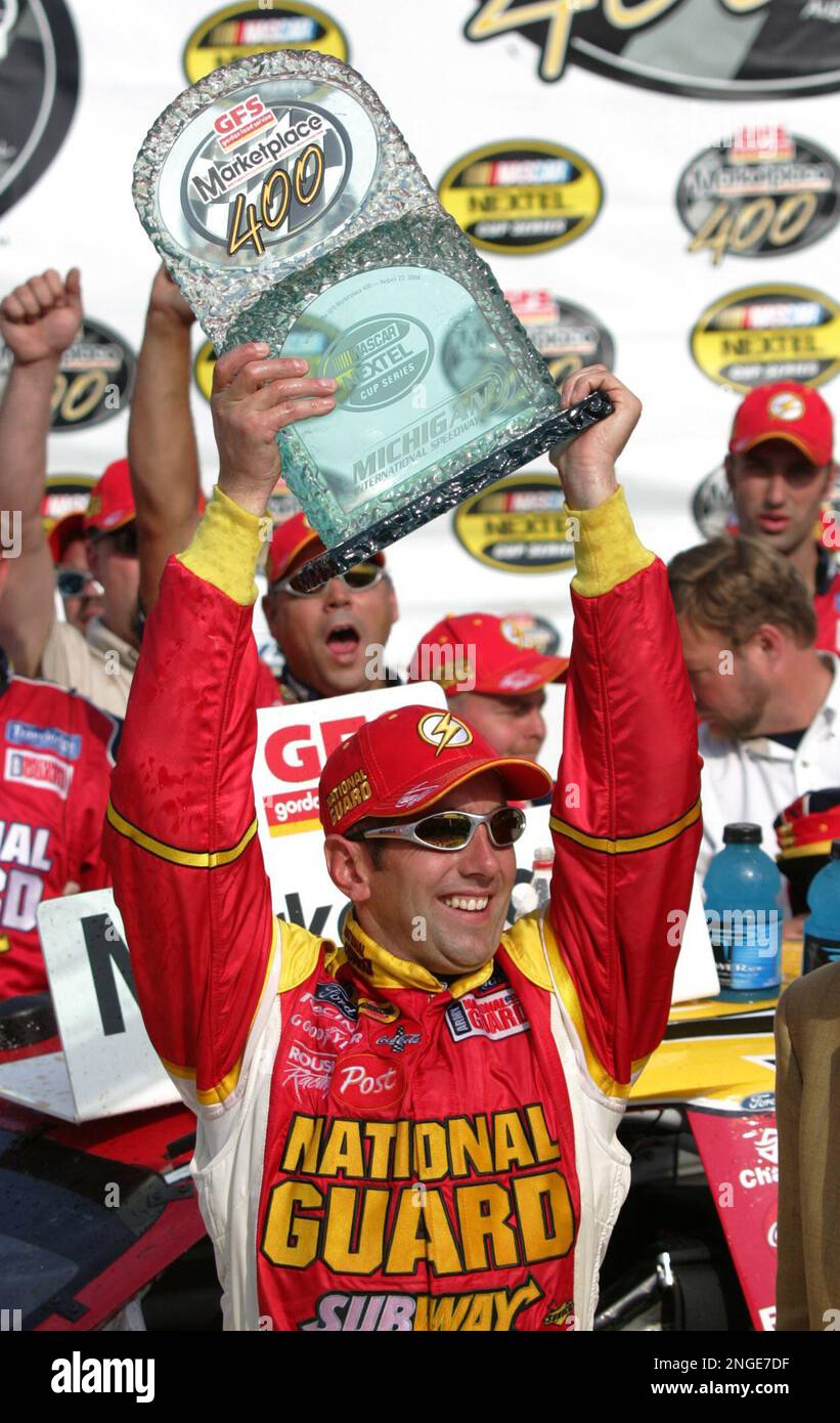 Greg Biffle hoists the trophy after his win in the NASCAAR GFS ...
