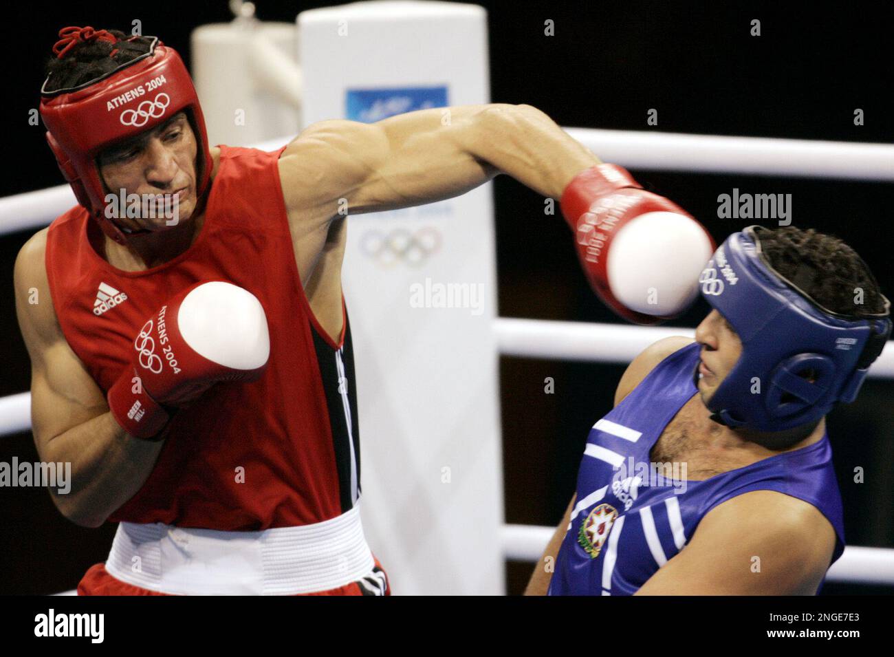 Syria's Naser Al Shami, left, delivers a punch to Azerbaijian's Vugar ...