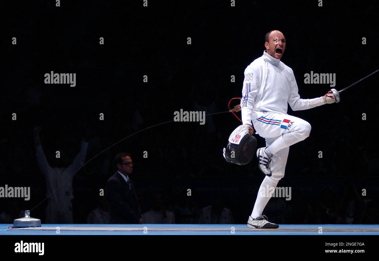 France's fencer Hugues Obry, celebrates his scores against Hungary's ...