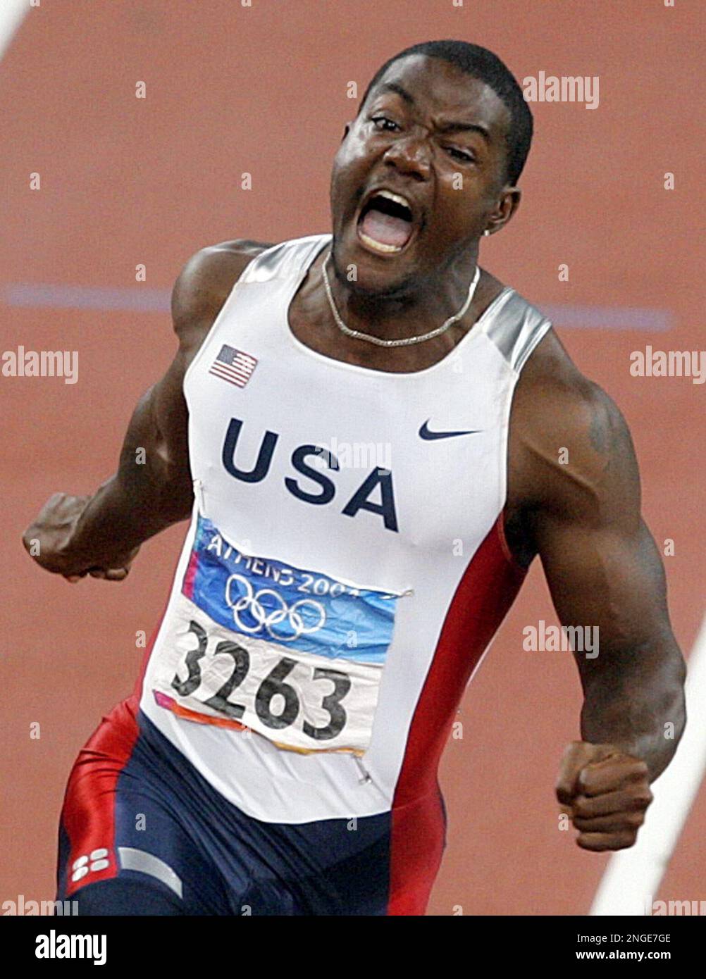Jason Gatlin, of the United States, reacts after winning the gold medal ...