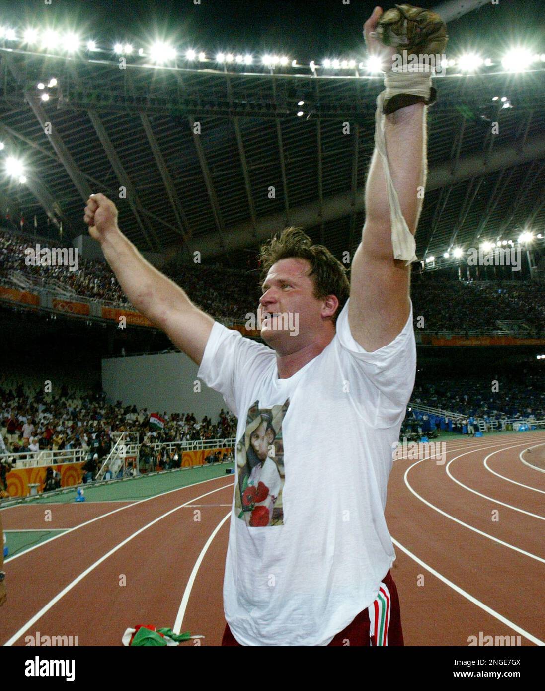 Hungary's Adrian Annus salutes the crowd, after winning the gold medal ...