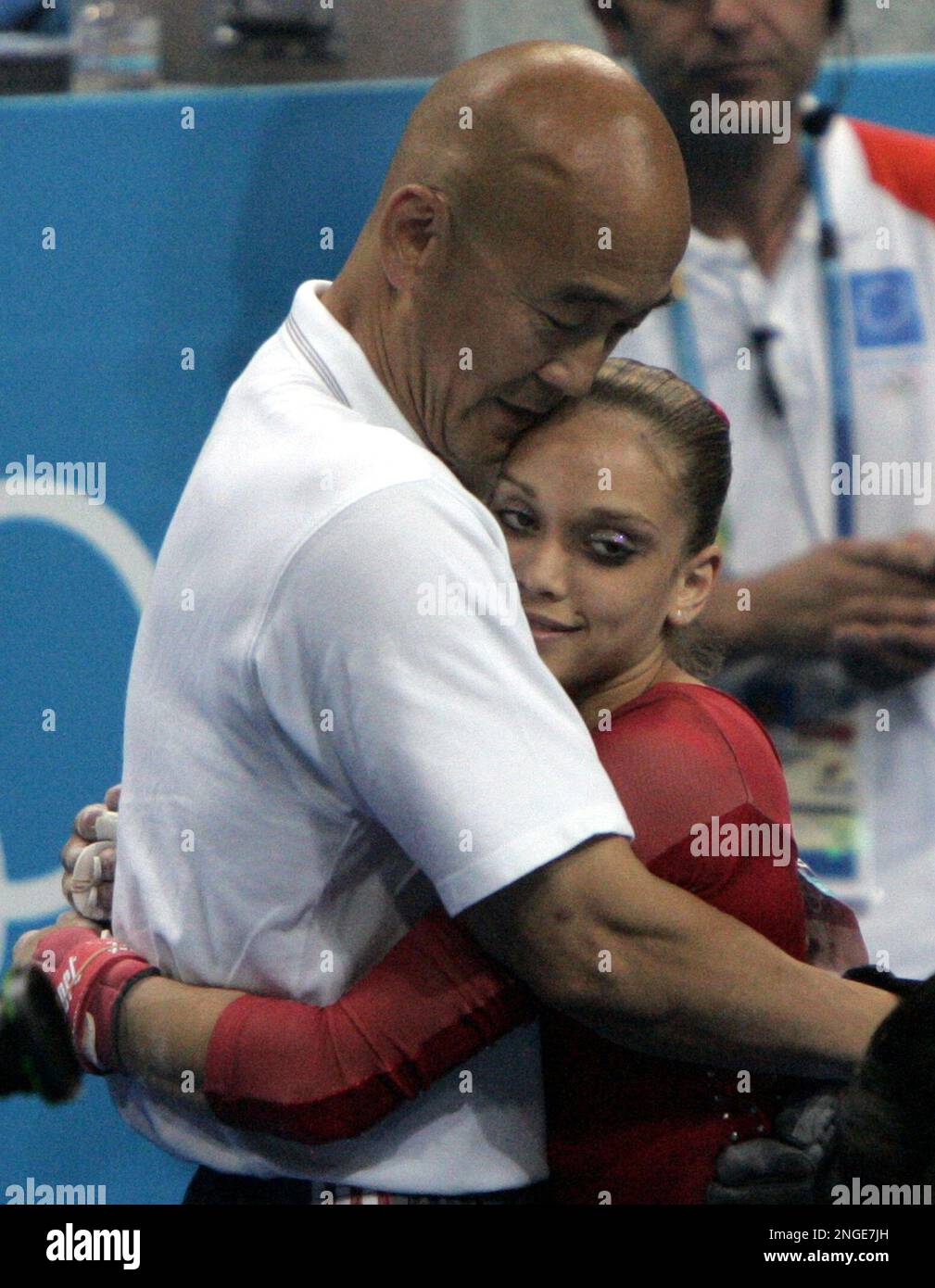 Terin Humphrey of the United States hugs her coach Al Fong after the ...