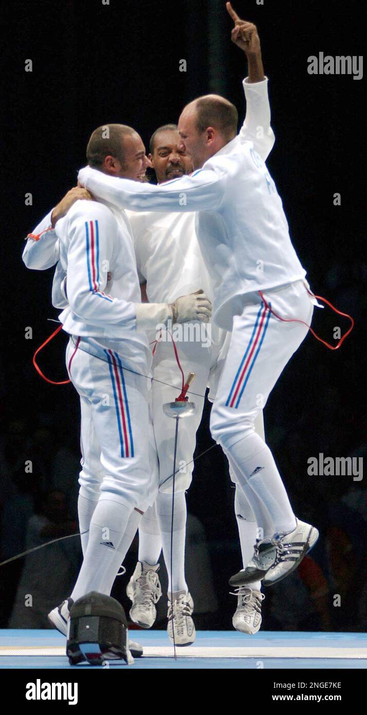 France's fencers Hugues Obry, right, Jerome Jeannet, center, and ...