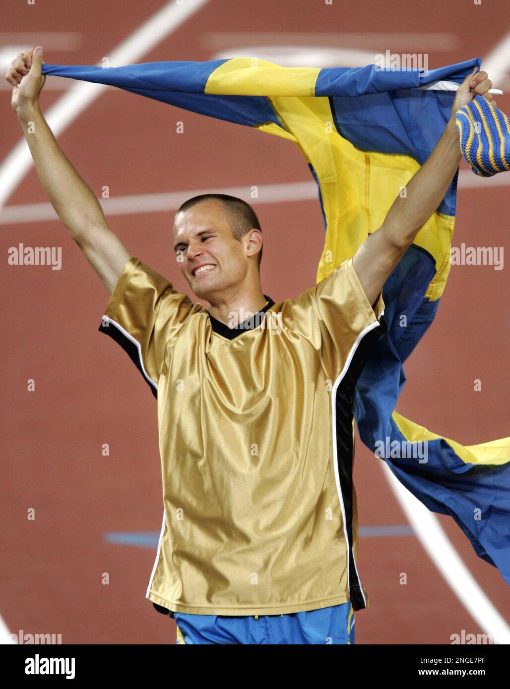 Stefan Holm, of Sweden, celebrates after winning the gold medal in the ...