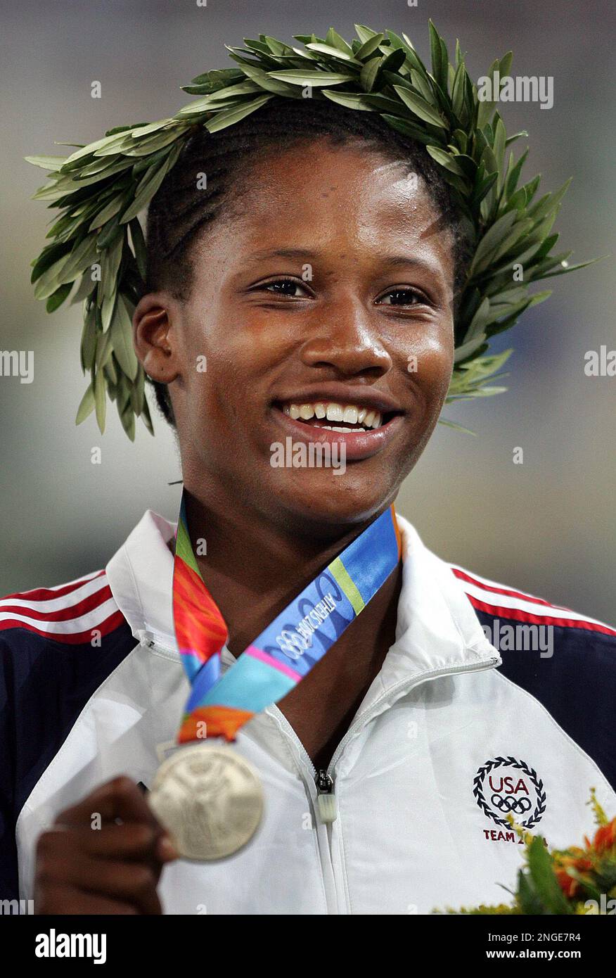 Lauryn Williams of the United States shows her silver medal during the ...