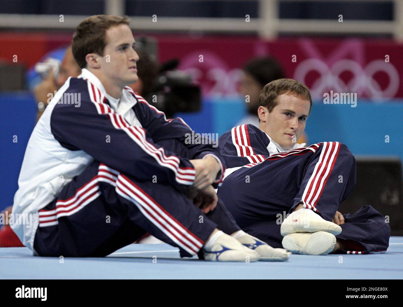 Morgan Hamm, left, of the United States and his brother Paul Hamm watch ...