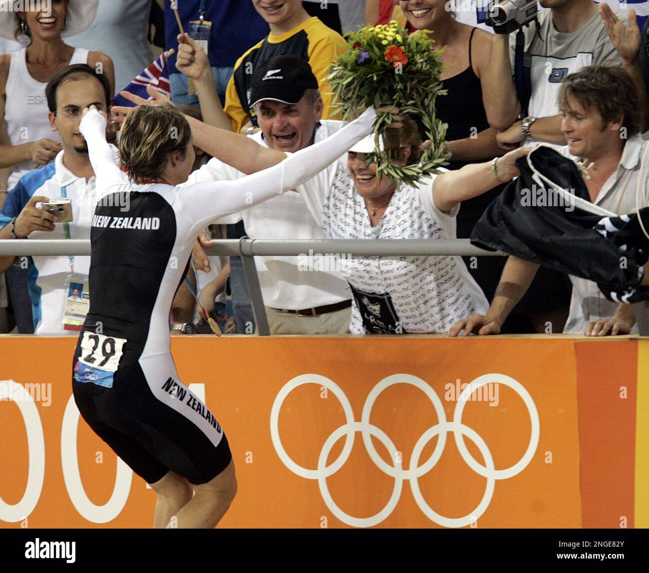 New Zealand's Sarah Ulmer rushes to embrace her mother Nuala, her ...