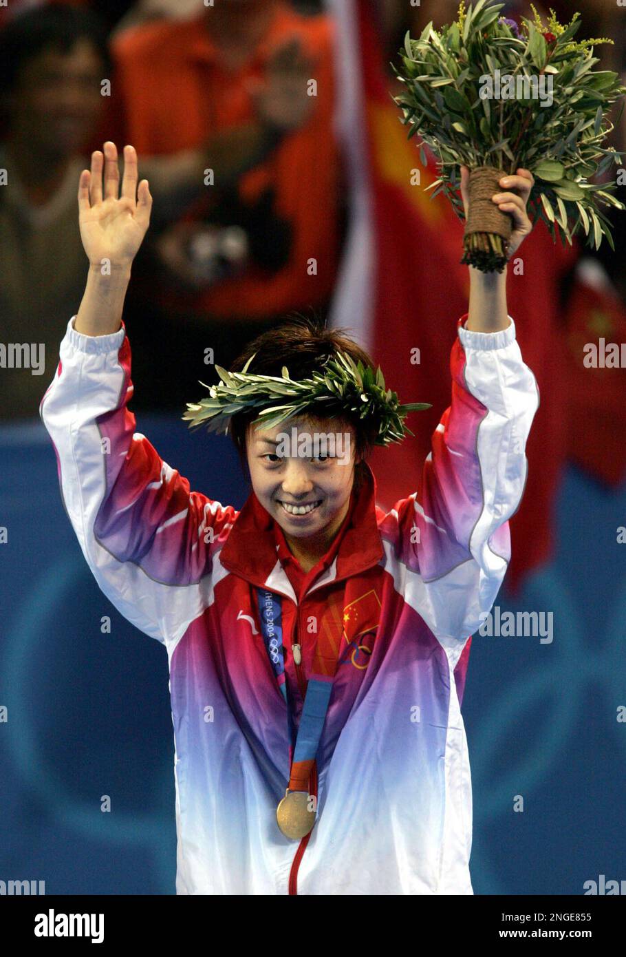 China's Zhang Yining celebrates after she received the gold medal in ...