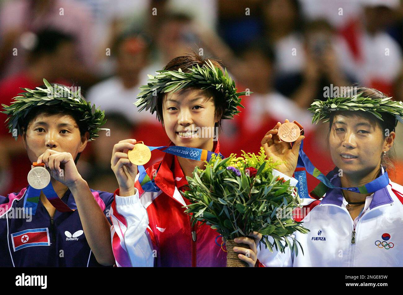 Silver medalist Kim Hyang Mi of North Korea, left, gold medalist Zhang ...
