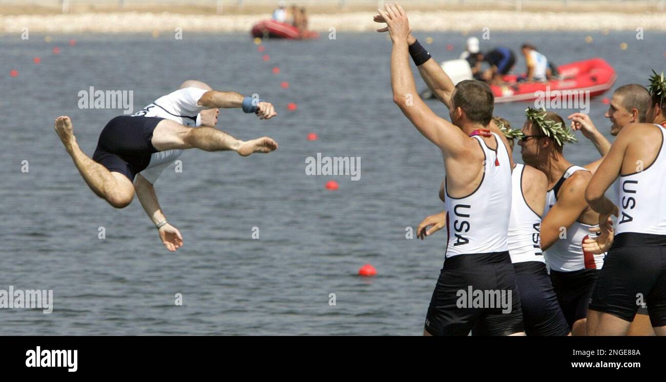 Members of the American Men's Eight boat throw their coxswain Pete ...
